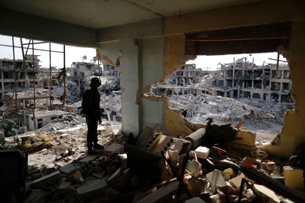 AP PHOTOS: Clearing the rubble in Syria's Yarmouk camp