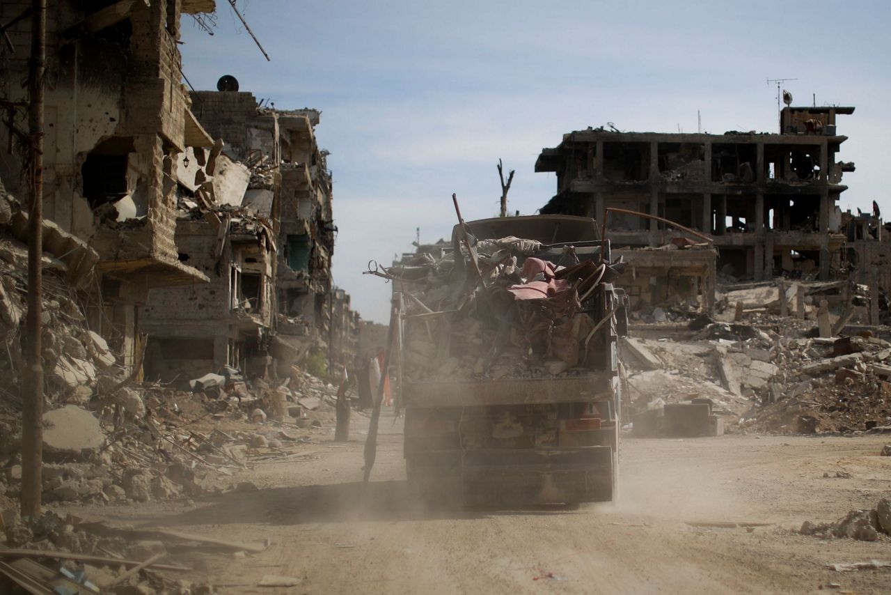 AP PHOTOS: Clearing the rubble in Syria's Yarmouk camp