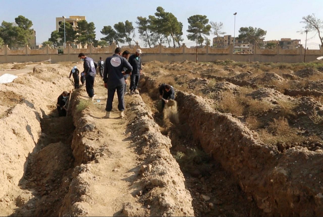 Hundreds of bodies exhumed from mass grave in Syria's Raqqa