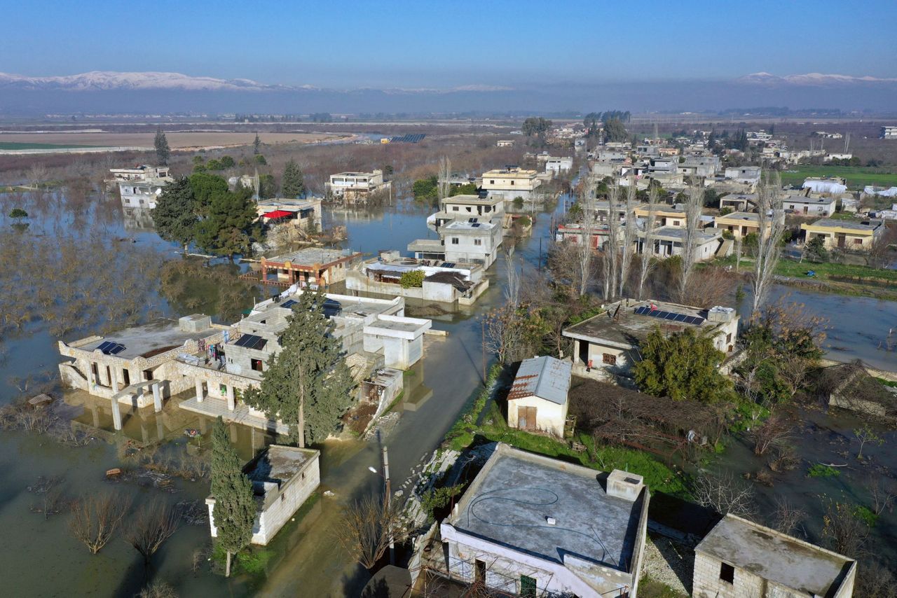 Days after quake, aid trucks reach northwest Syrian enclave