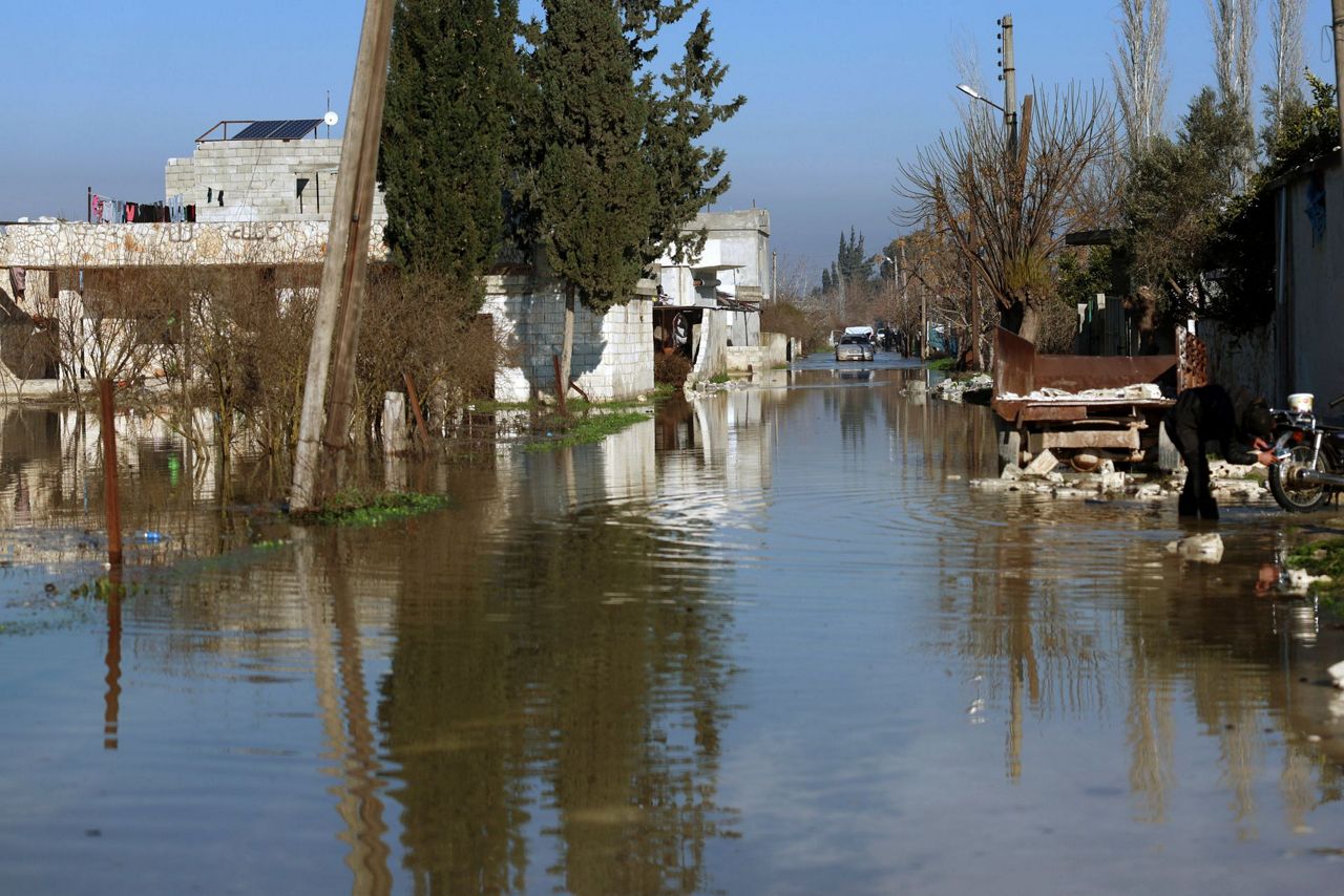 Days after quake, aid trucks reach northwest Syrian enclave