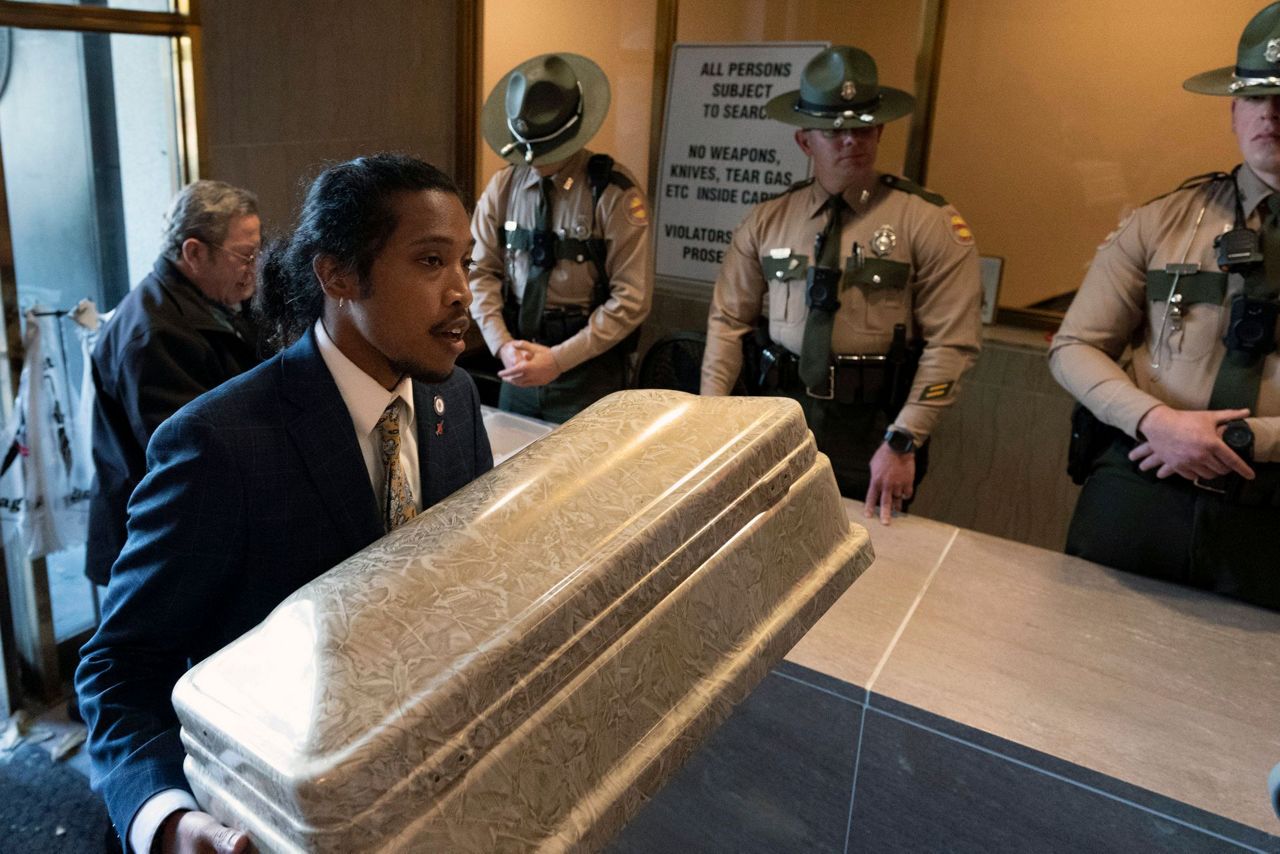 Gun safety demonstrators carry caskets to Tennessee Capitol