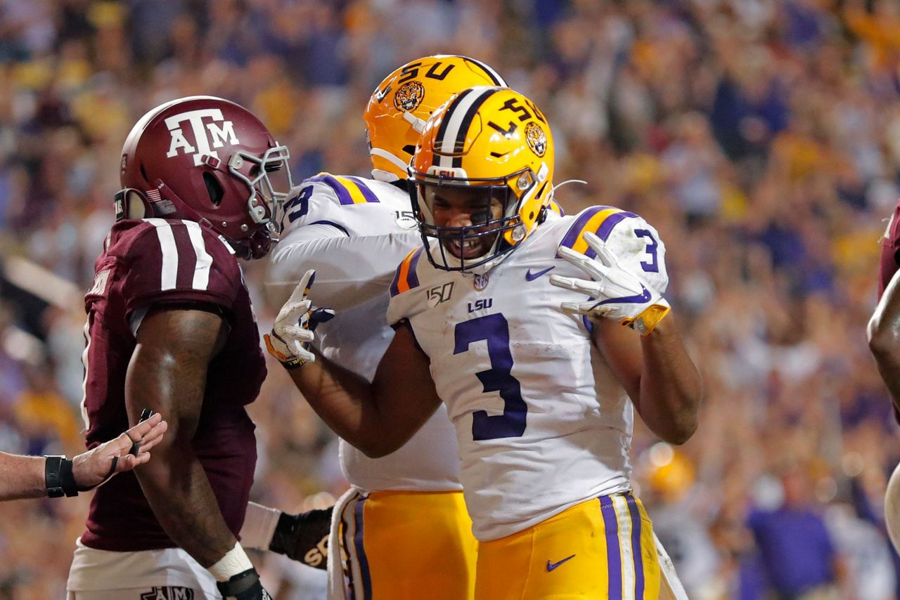 LSU's Edwards-Helaire still mending, a no-show for media day