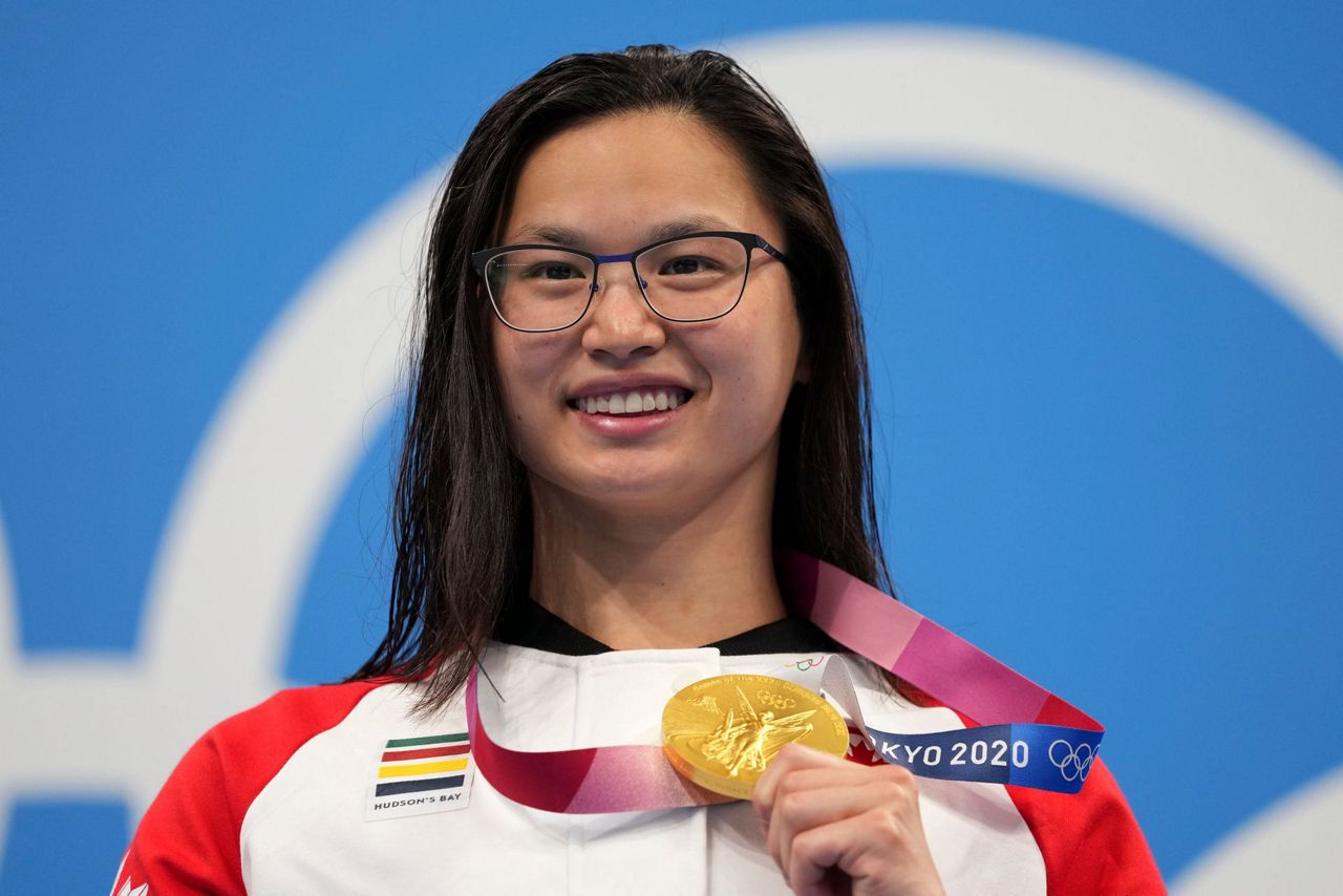 All a blur as Canada's MacNeil claims 2 medals at Olympics