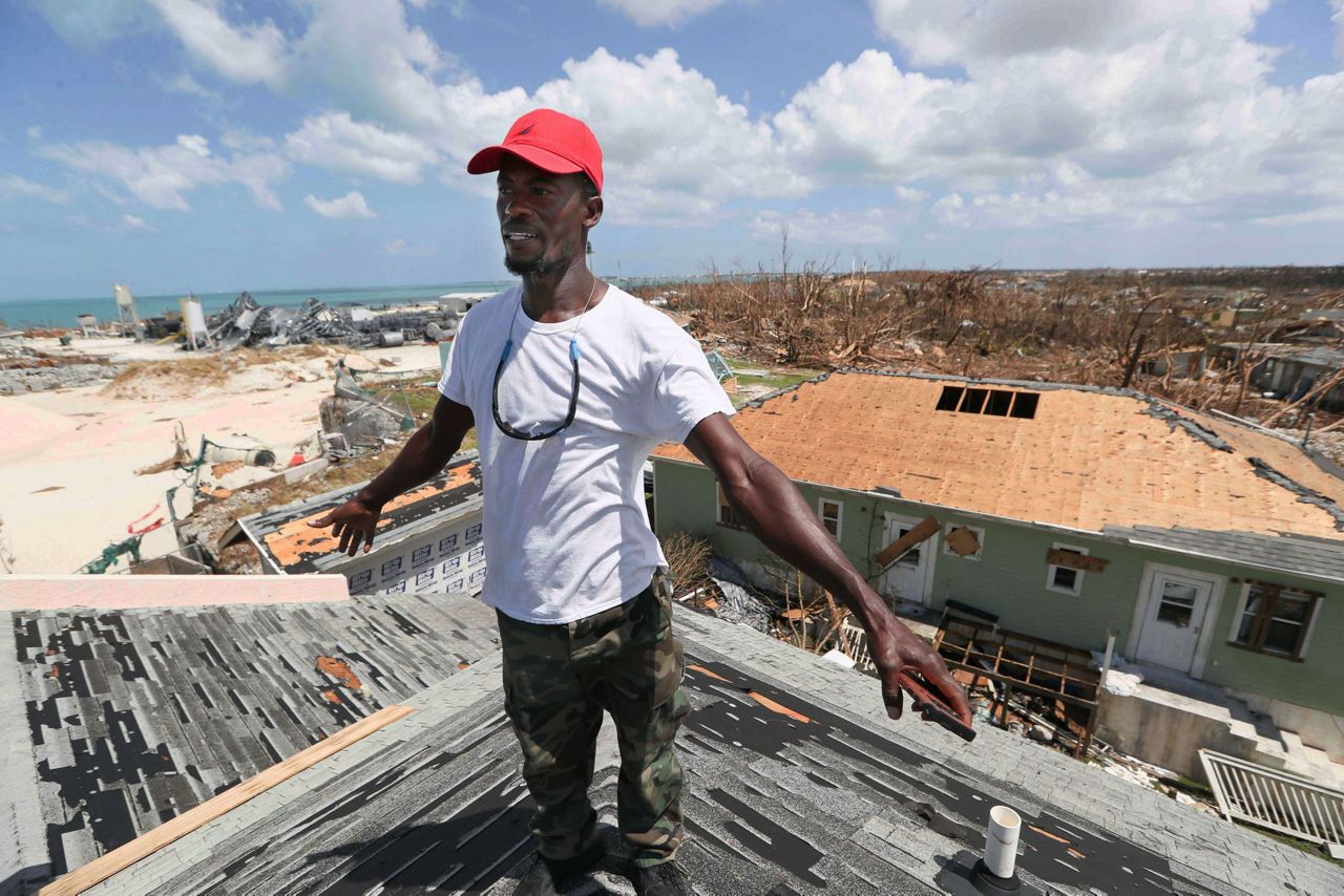 Silence, devastation mark Bahamas town; but some are staying