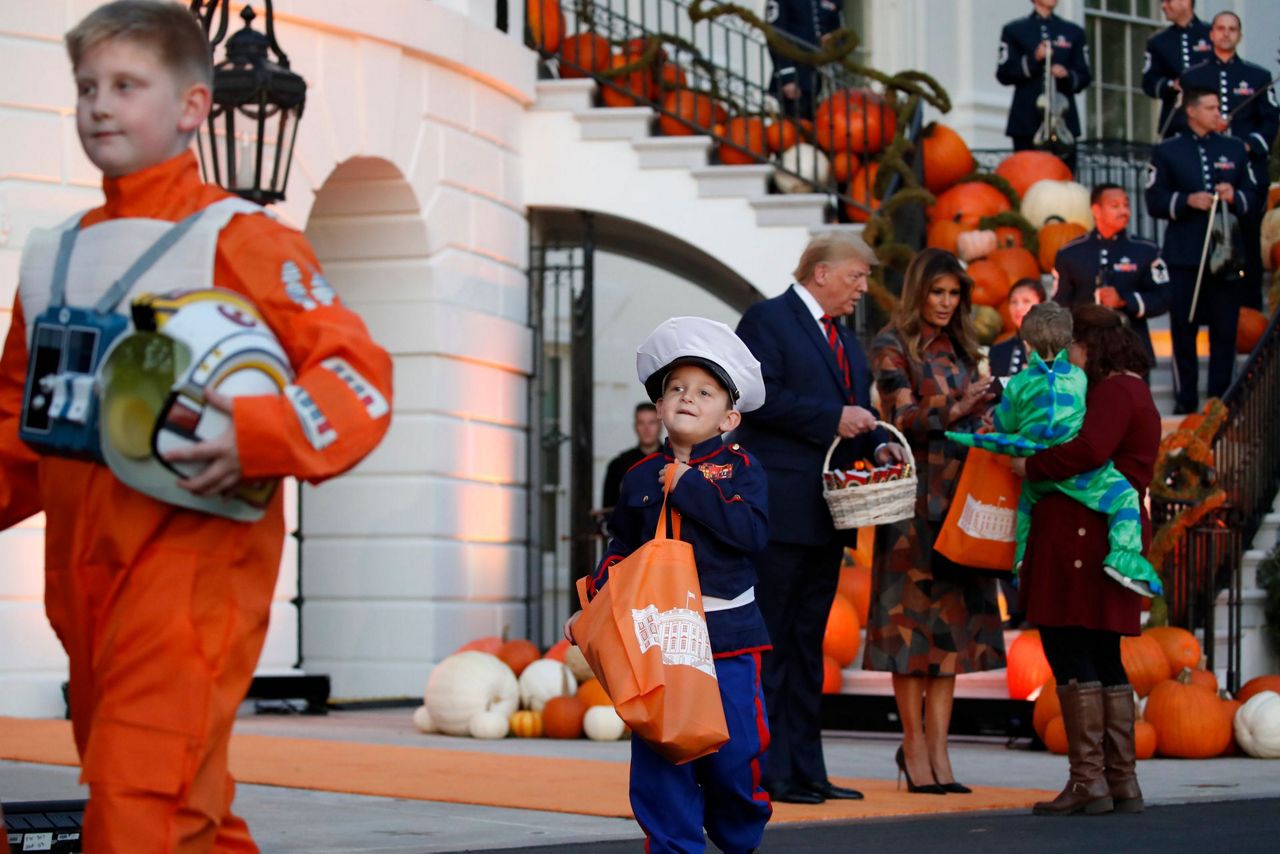 Trumps hand out Halloween candy, greet kids at White House