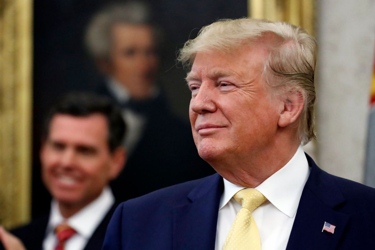 Trump honors economist who advised him on lowering taxes