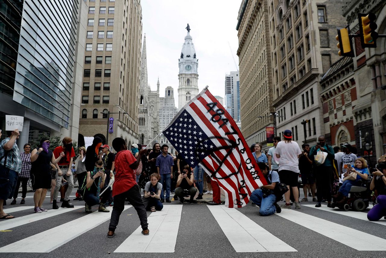 Protesters use images of Flyers' new mascot to decry Trump