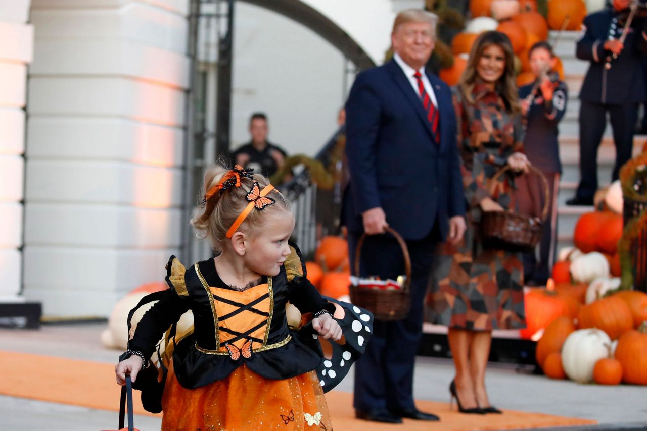 Trumps hand out Halloween candy, greet kids at White House