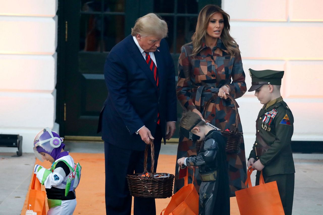 Trumps hand out Halloween candy, greet kids at White House