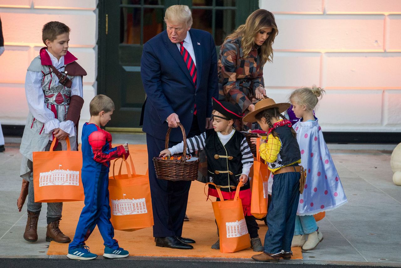 Trumps hand out Halloween candy, greet kids at White House