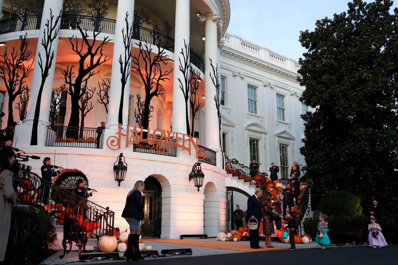 Trumps hand out Halloween candy, greet kids at White House