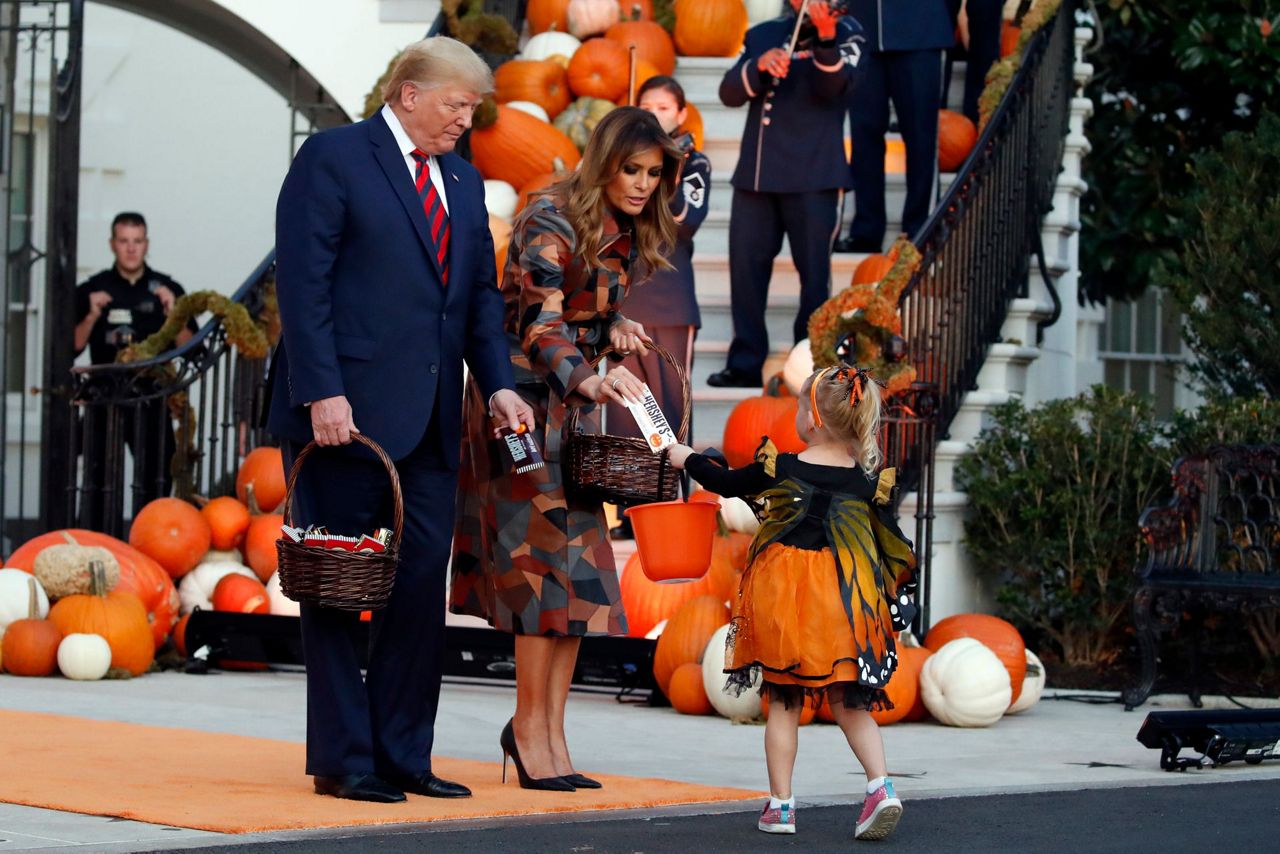 Trumps hand out Halloween candy, greet kids at White House