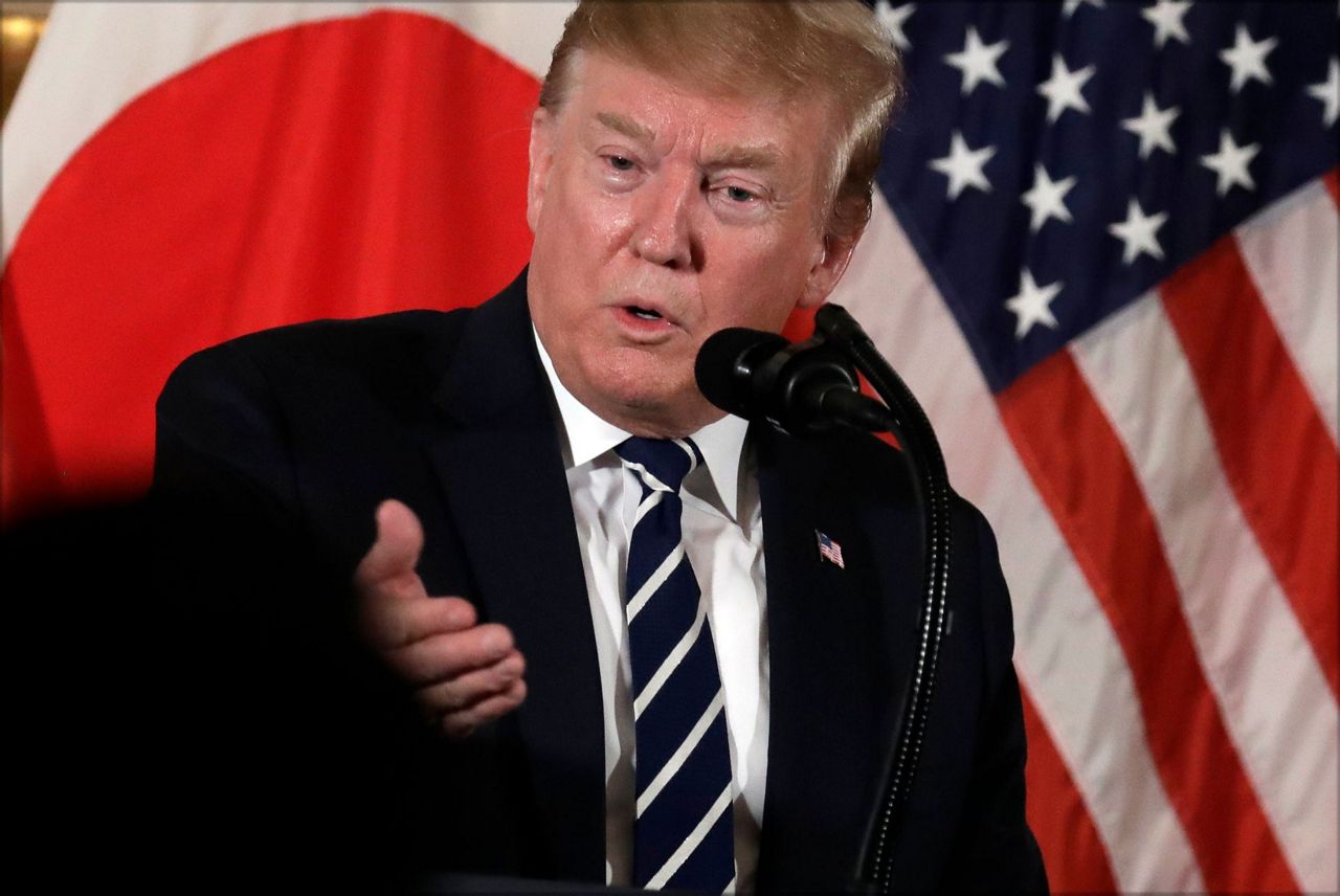 Japan welcomes Trump with a charm campaign, golf and sumo