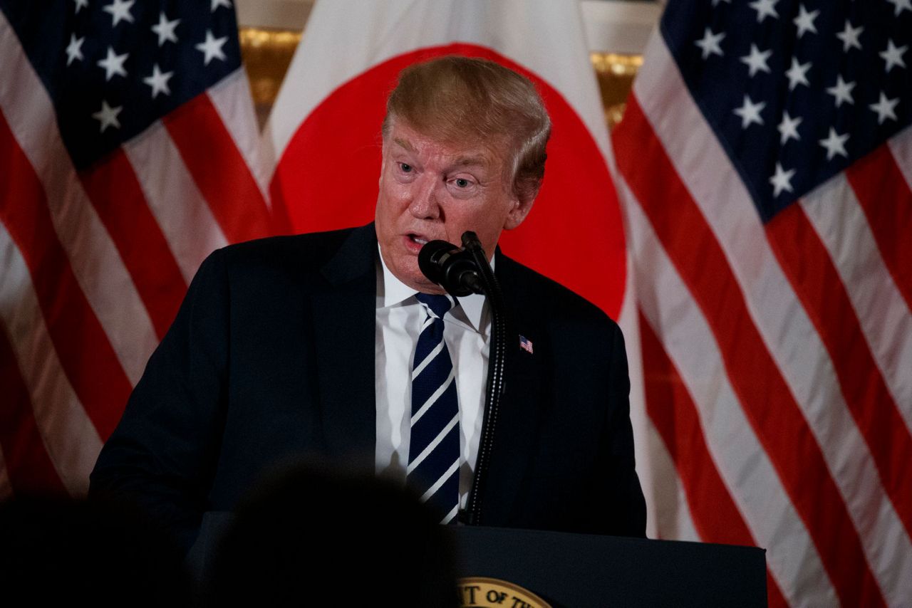 Japan welcomes Trump with a charm campaign, golf and sumo