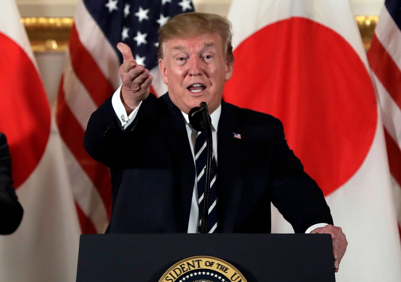 Japan welcomes Trump with a charm campaign, golf and sumo
