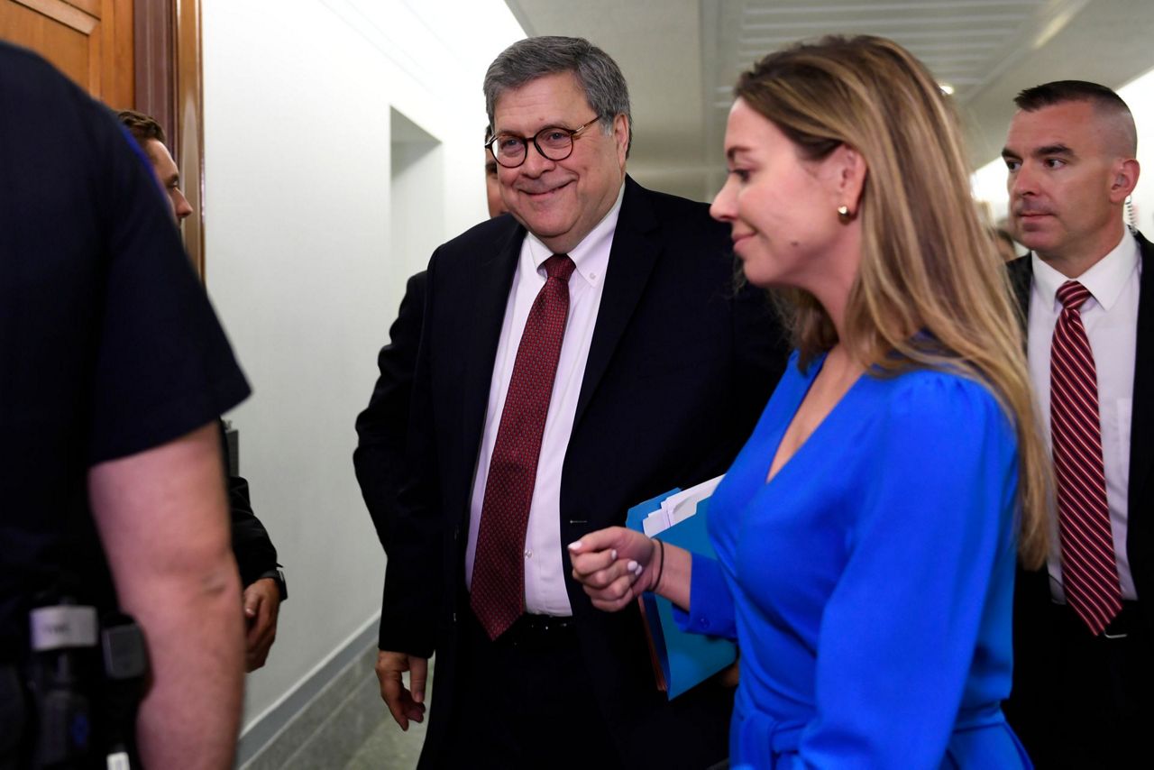 The Latest: Barr defends report handling in his testimony