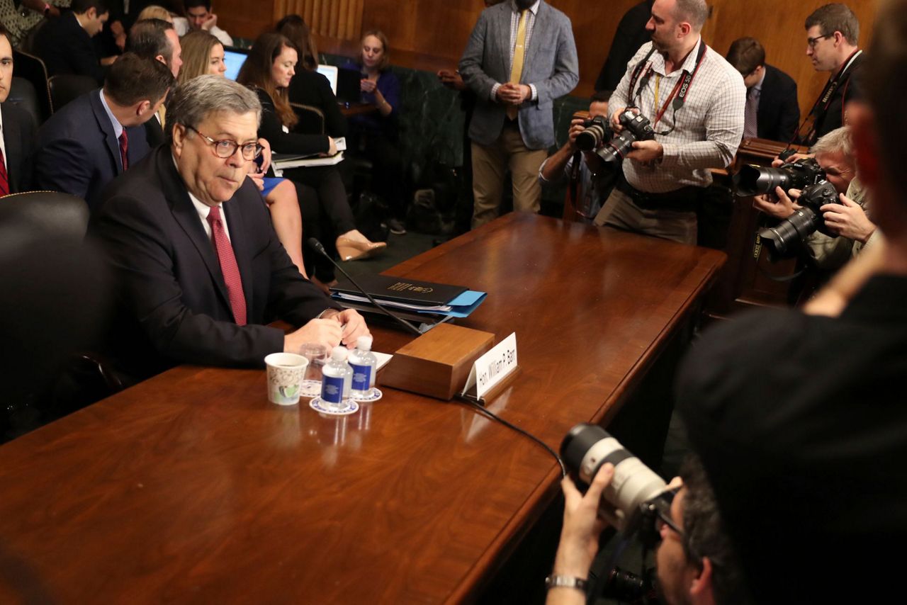 The Latest: Barr defends report handling in his testimony