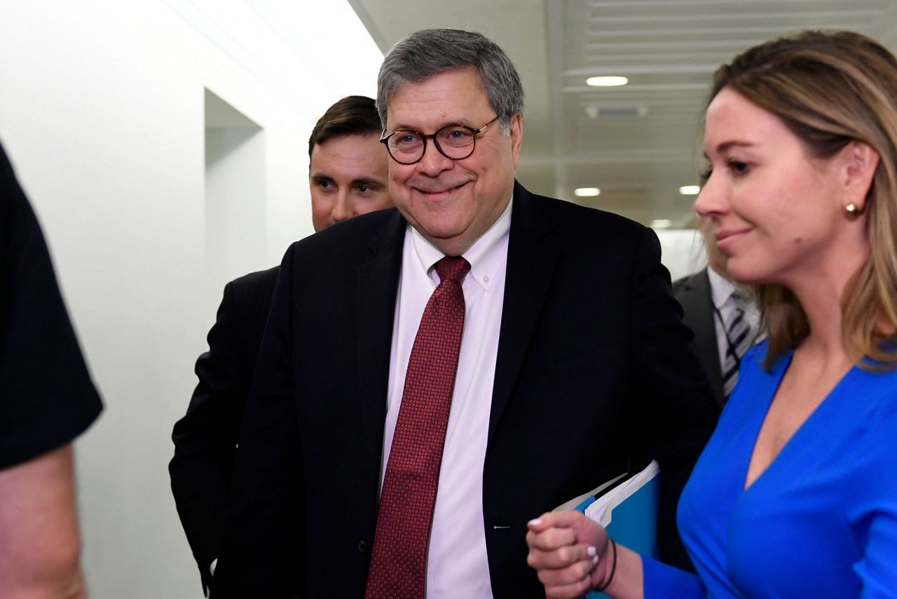 The Latest: Barr defends report handling in his testimony