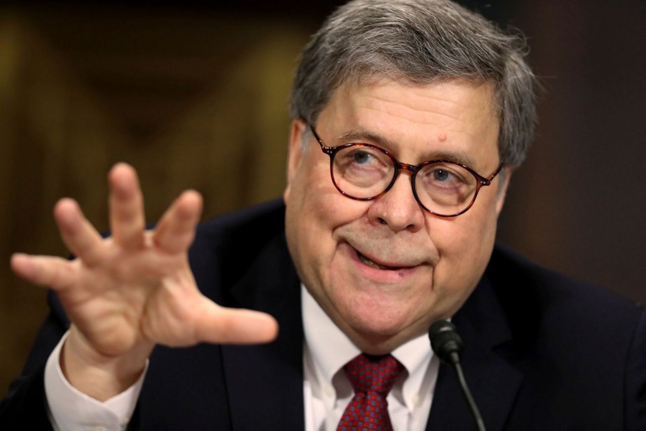 The Latest: Barr defends report handling in his testimony