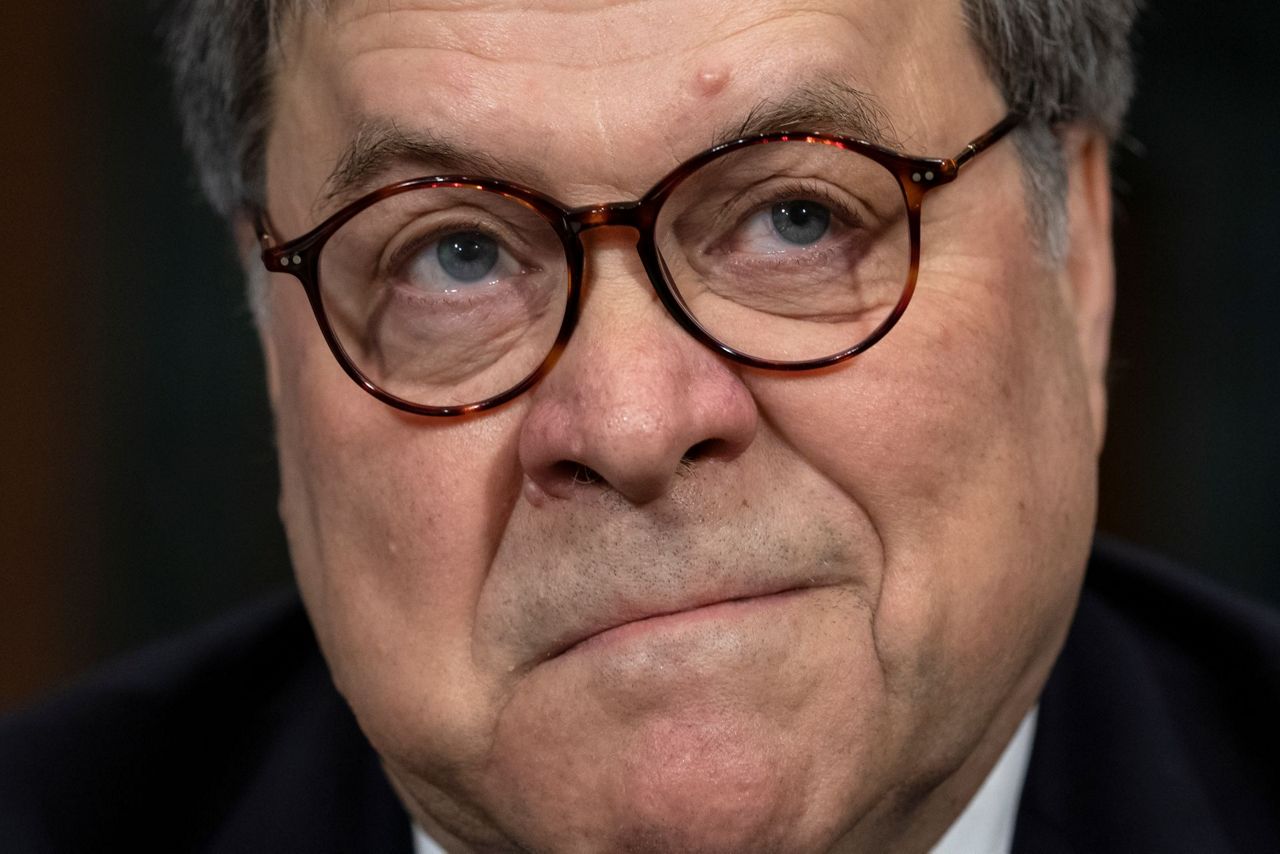 The Latest: Barr defends report handling in his testimony