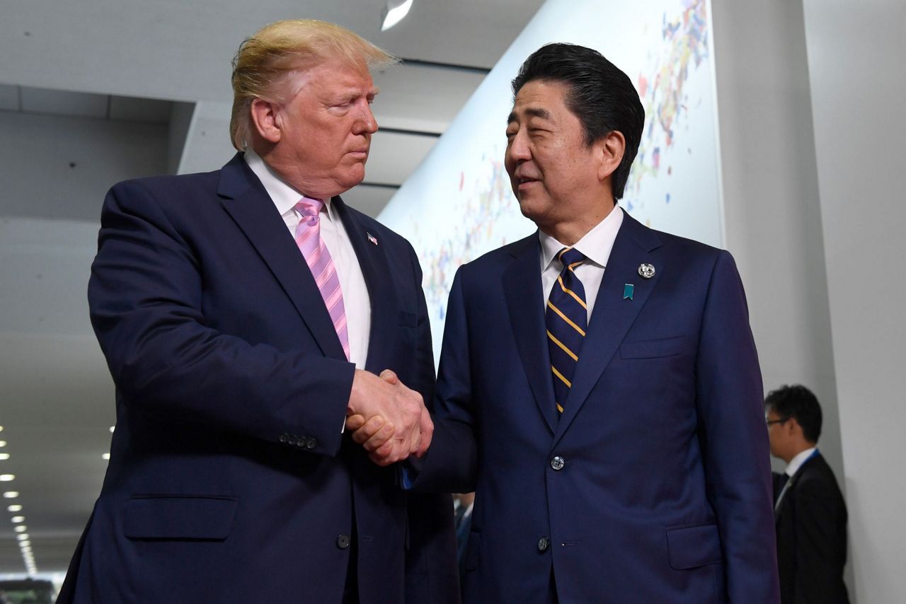 The Latest: Trump kicks off G-20 trip with meeting with Abe