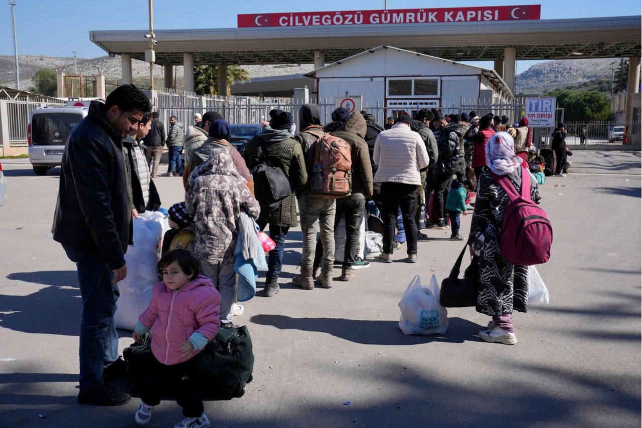 Days after quake, aid trucks reach northwest Syrian enclave