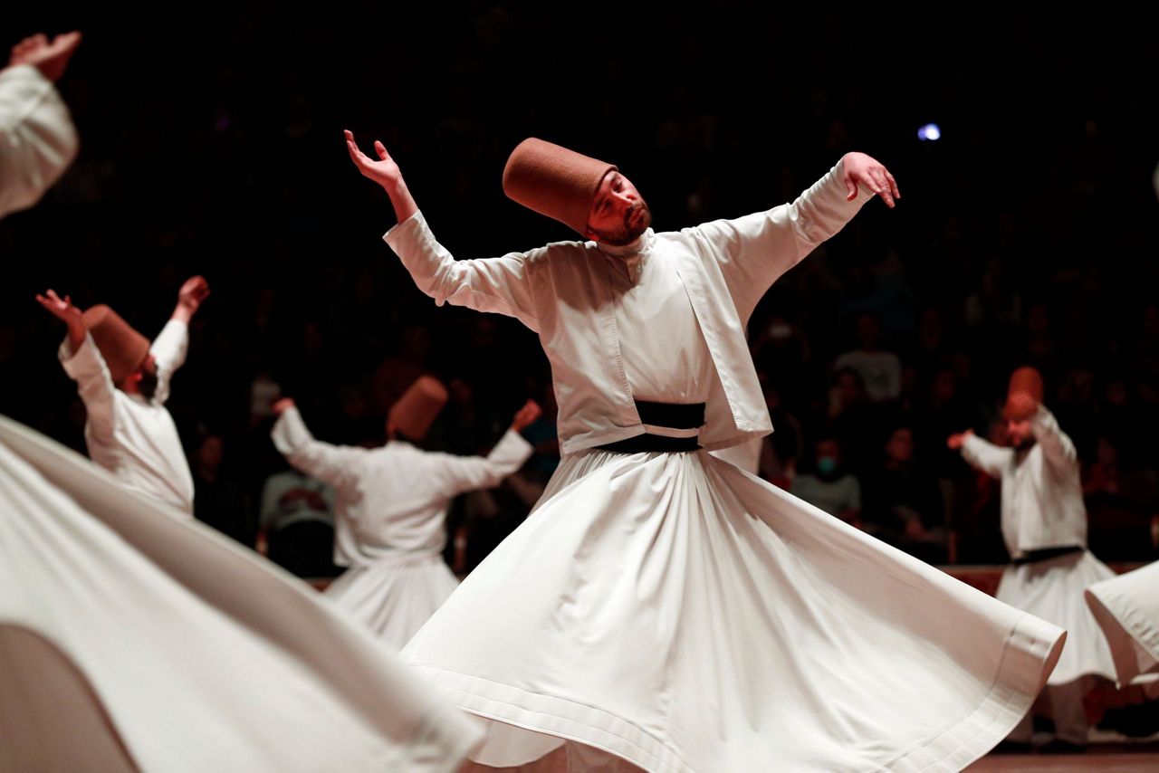 AP PHOTOS: Turkey's whirling dervishes honor Sufi poet