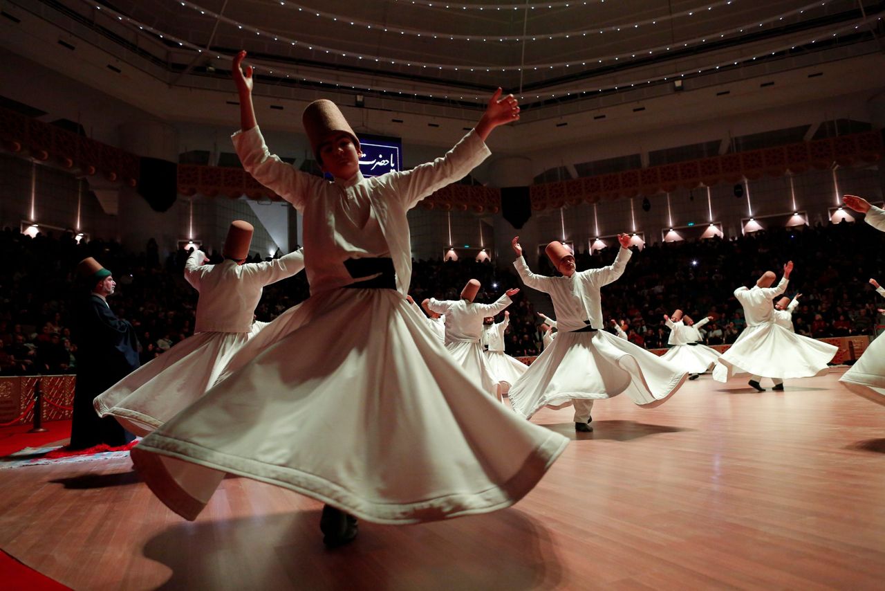 AP PHOTOS: Turkey's whirling dervishes honor Sufi poet