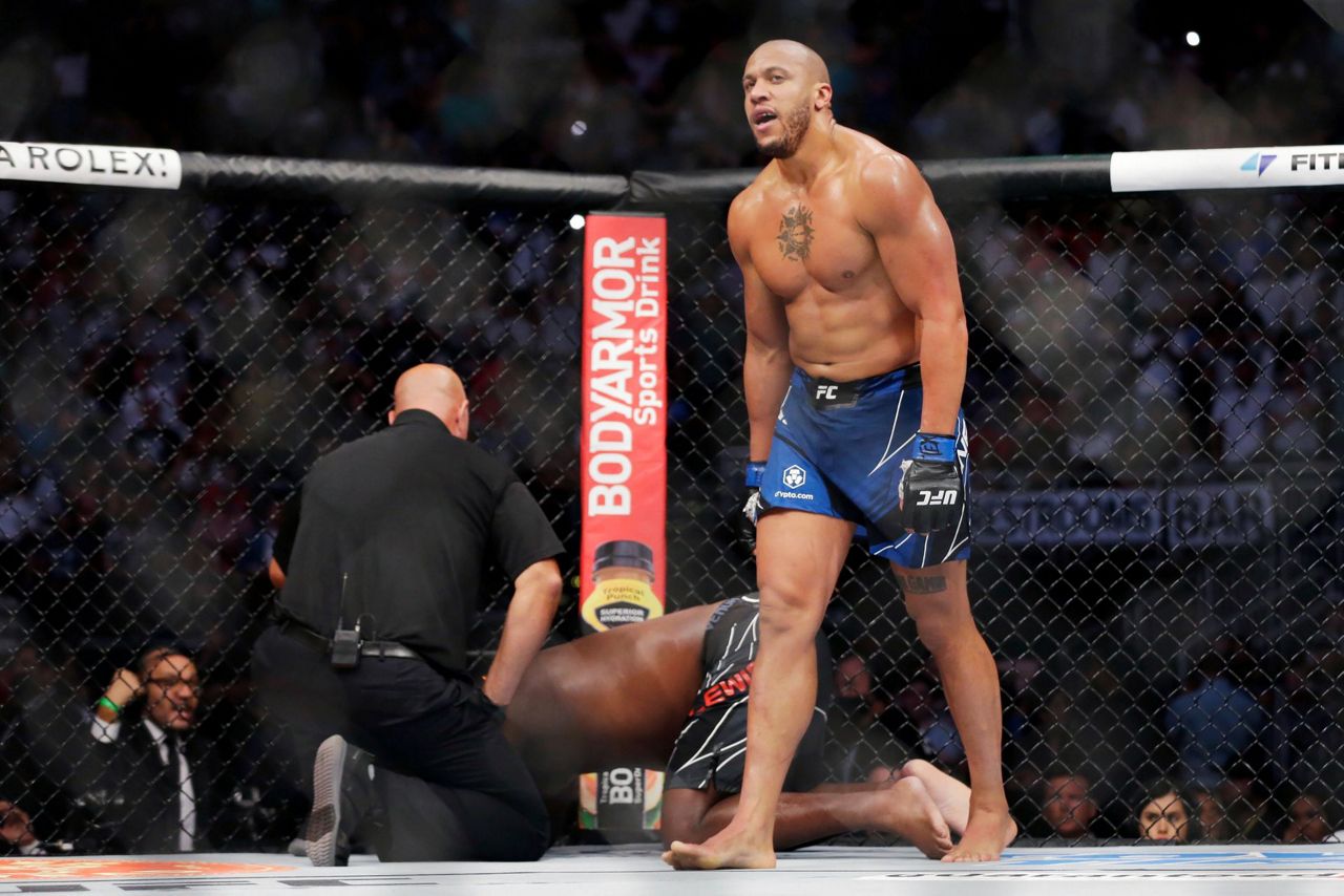 Gane stops Lewis, wins interim heavyweight title at UFC 265