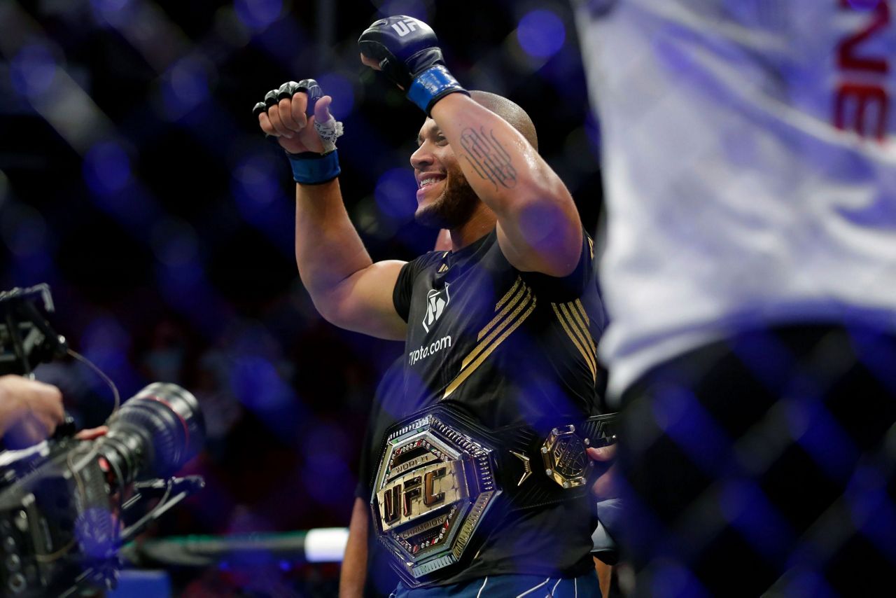 Gane stops Lewis, wins interim heavyweight title at UFC 265