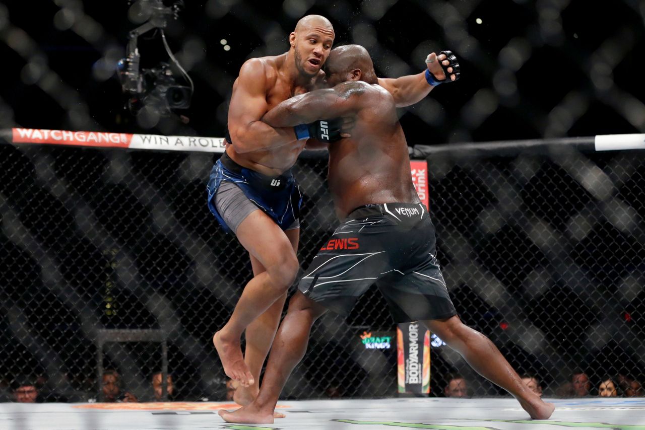 Gane stops Lewis, wins interim heavyweight title at UFC 265