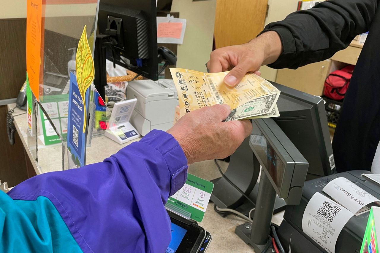 Powerball numbers drawn, players await record jackpot result