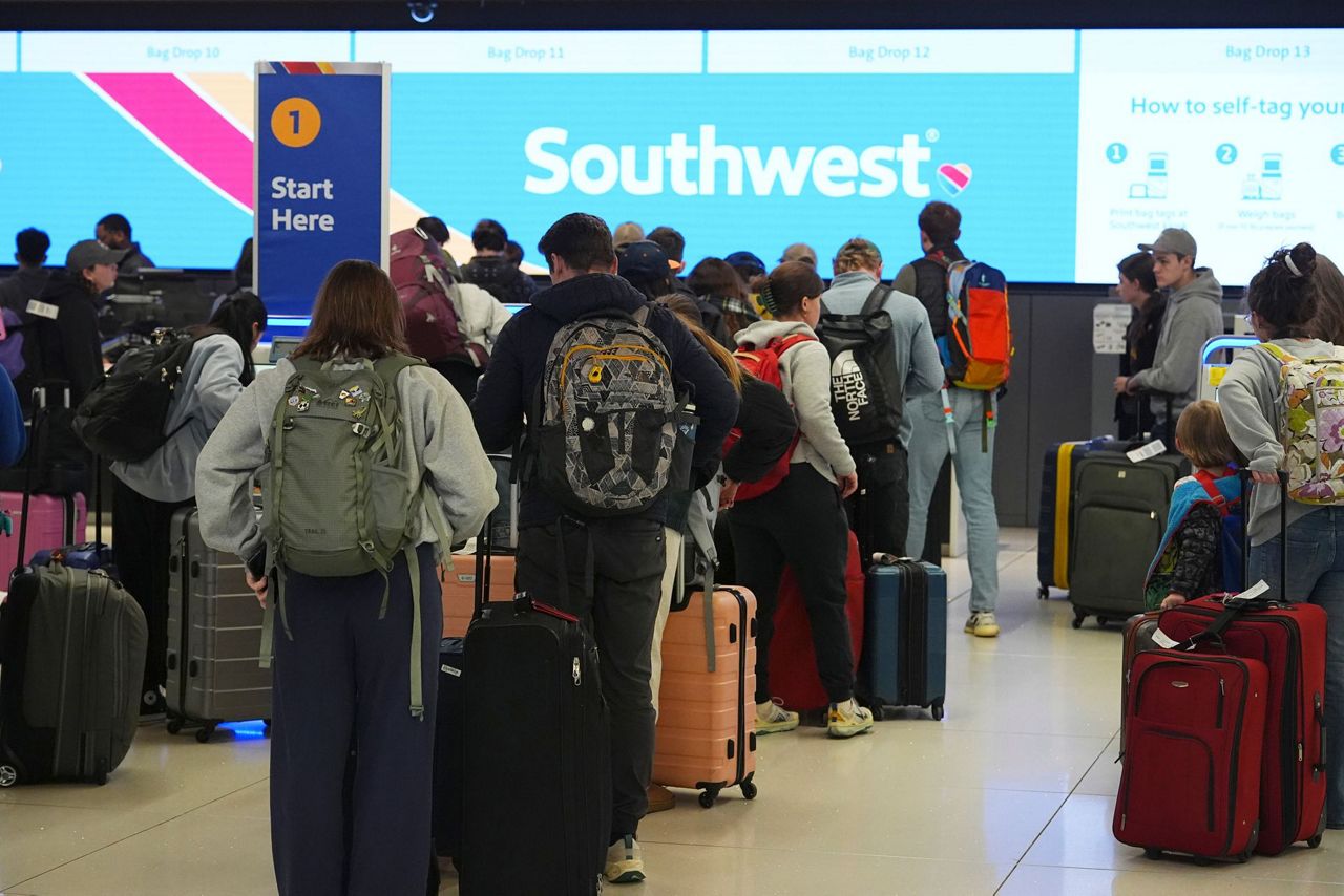 Southwest Airlines breaks with another tradition and checked bags will ...