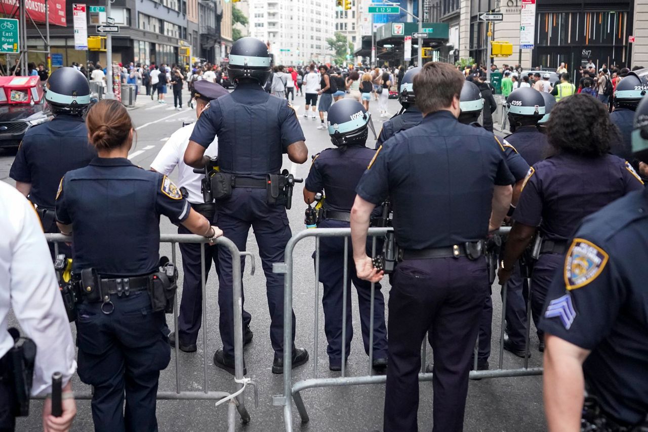 Crowd overwhelms New York City's Union Square, tosses chairs, climbs on ...