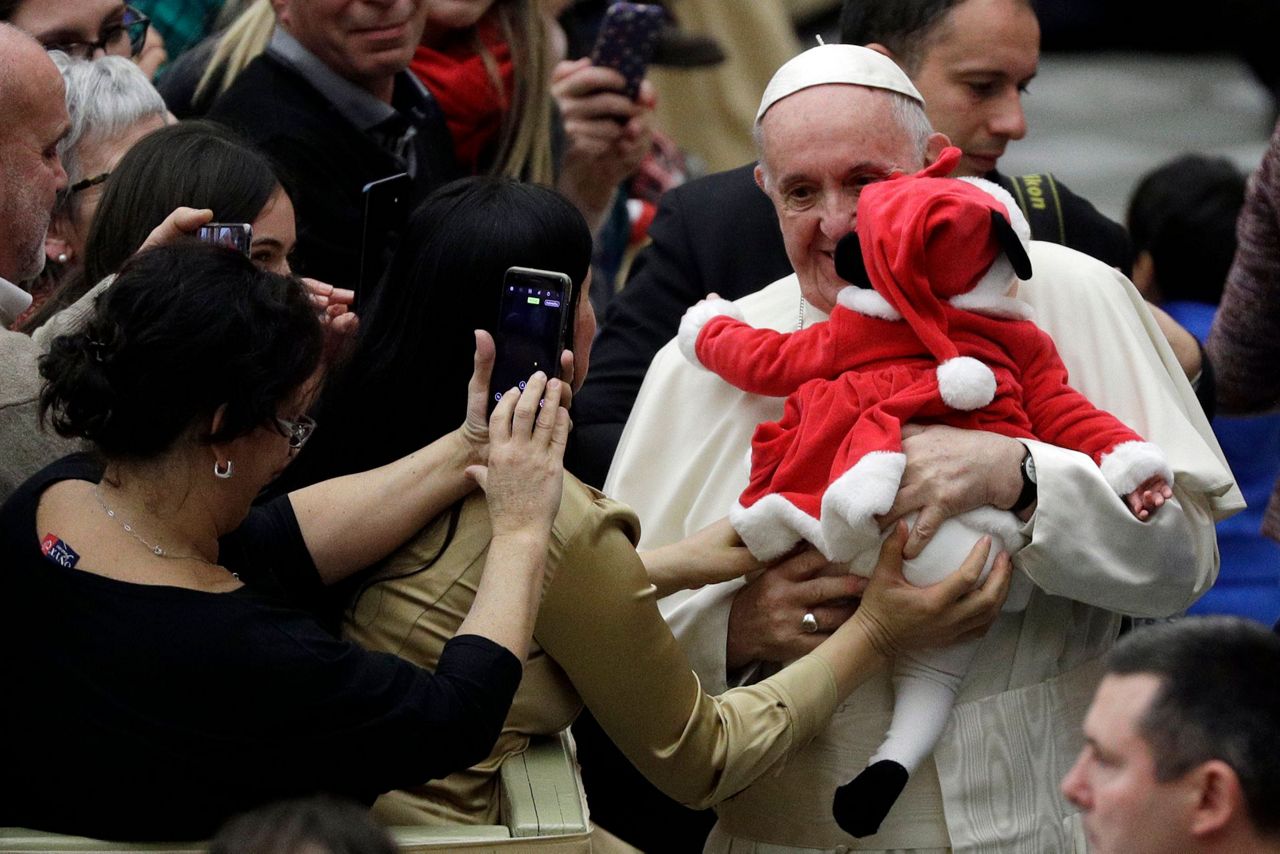 Kids at a Vatican charity give Pope Francis a birthday cake