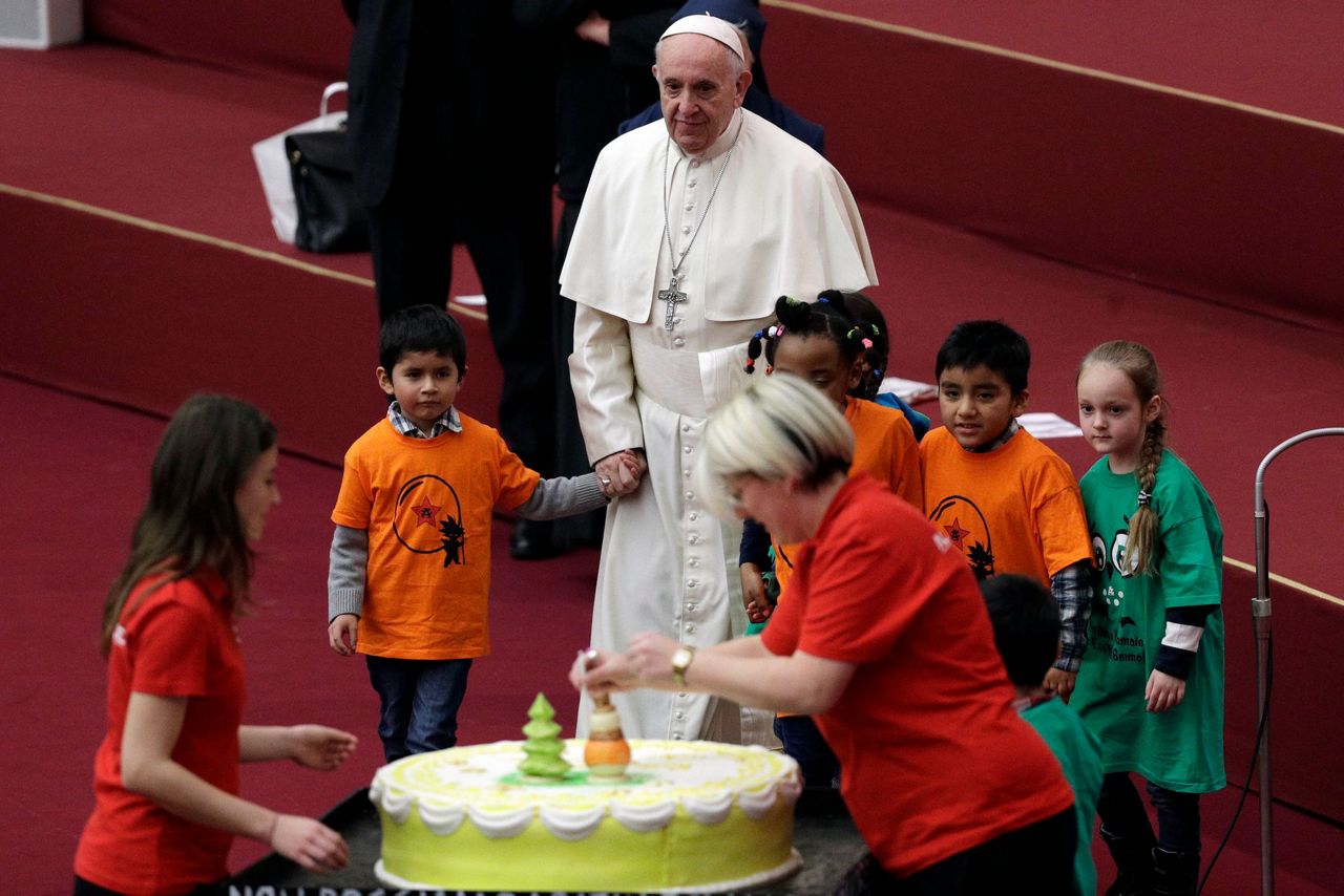 Kids at a Vatican charity give Pope Francis a birthday cake