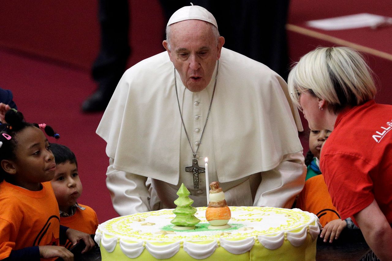 Kids at a Vatican charity give Pope Francis a birthday cake