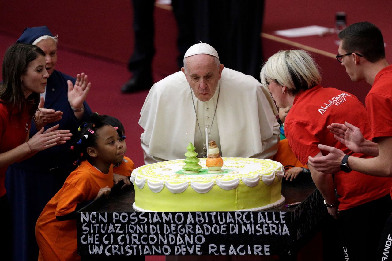 Kids at a Vatican charity give Pope Francis a birthday cake