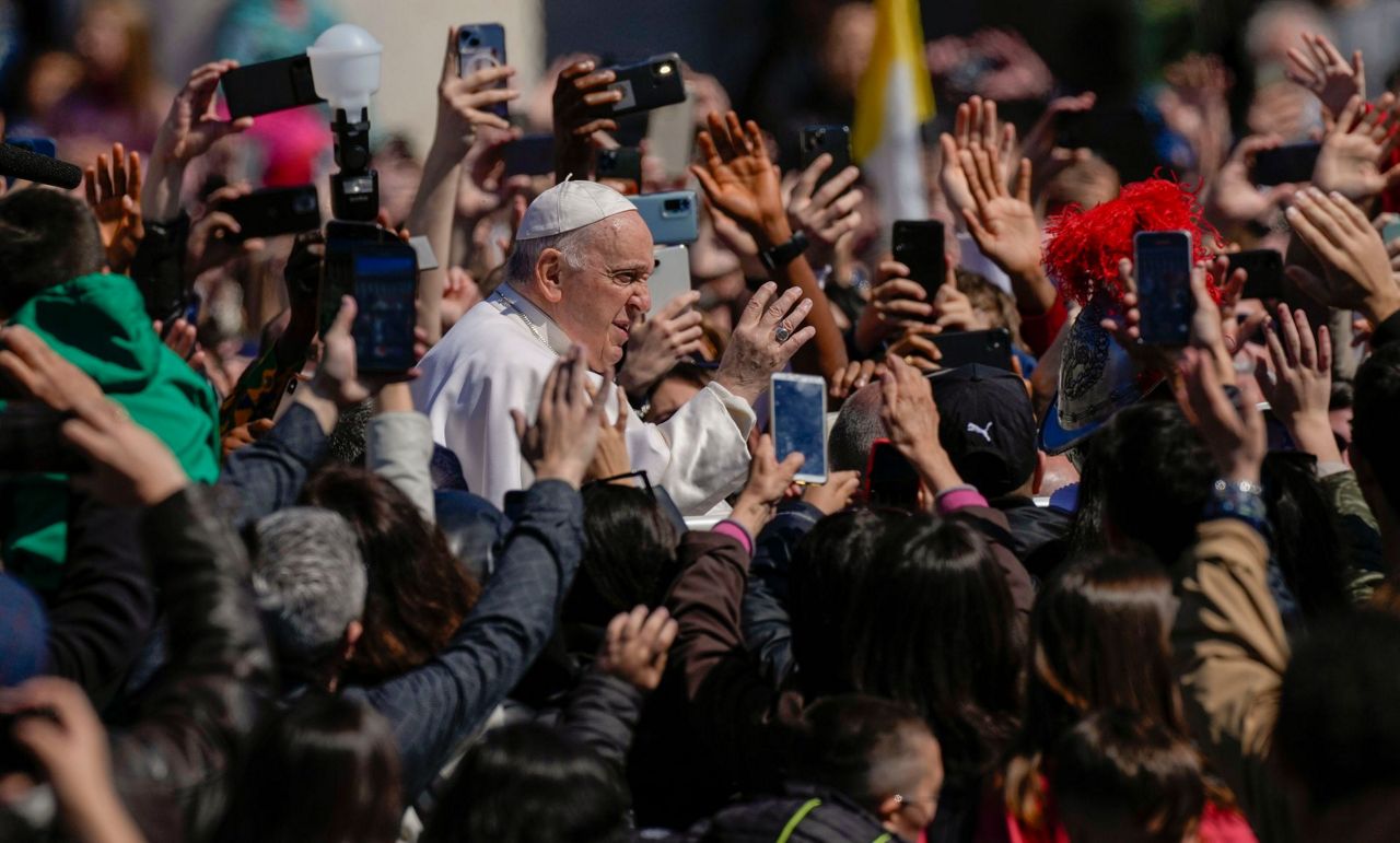 Pope, big crowd mark Easter in flower-adorned Vatican square