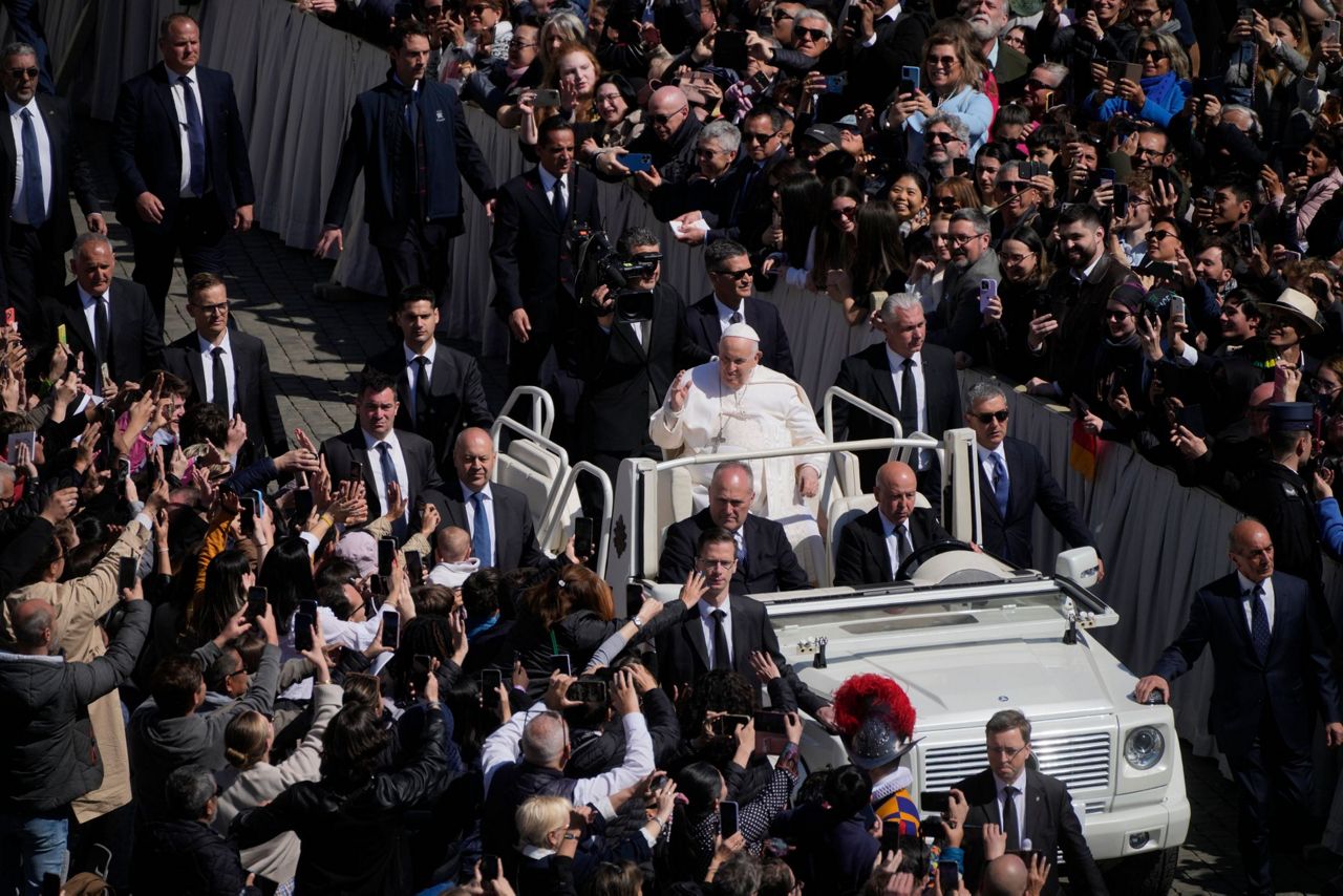 Pope, big crowd mark Easter in flower-adorned Vatican square