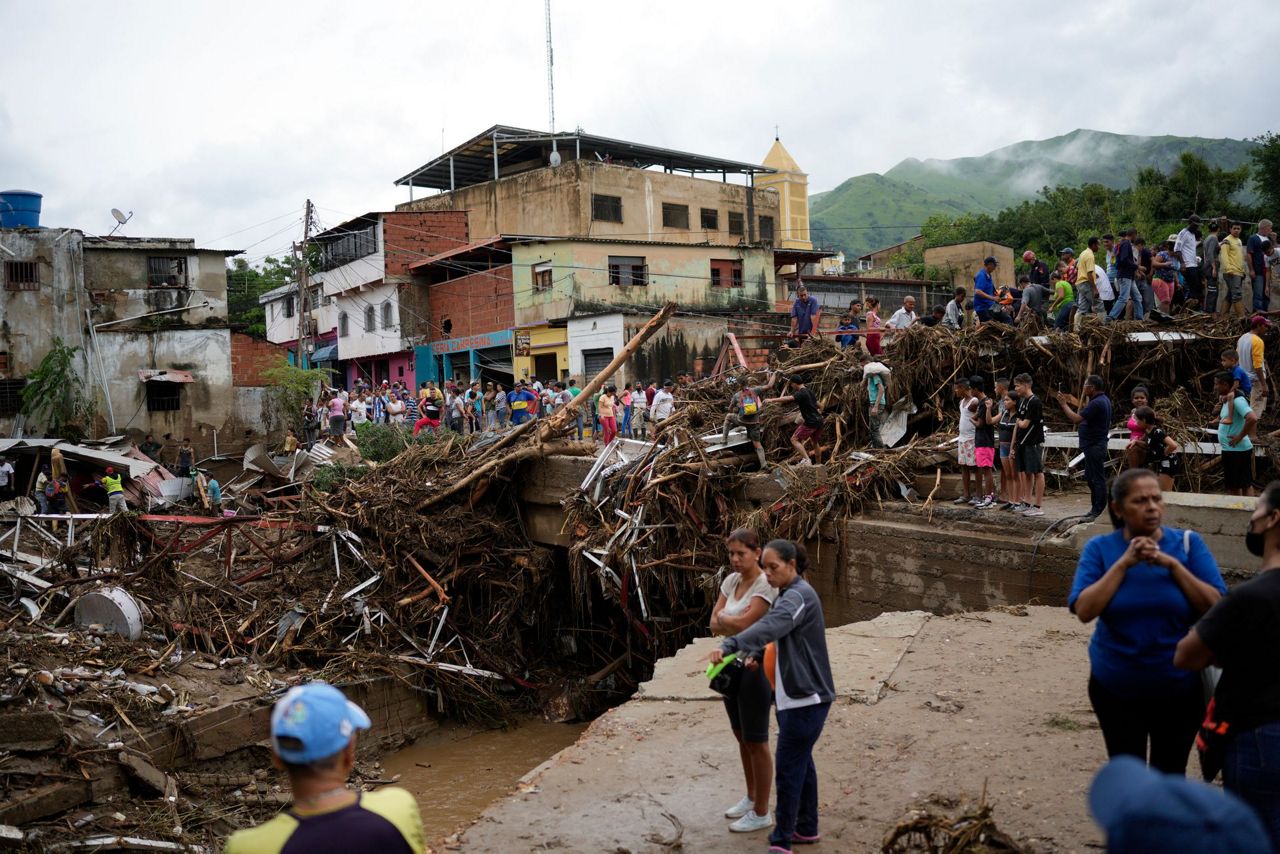 Rain-fueled landslide sweeps through Venezuela town; 22 dead
