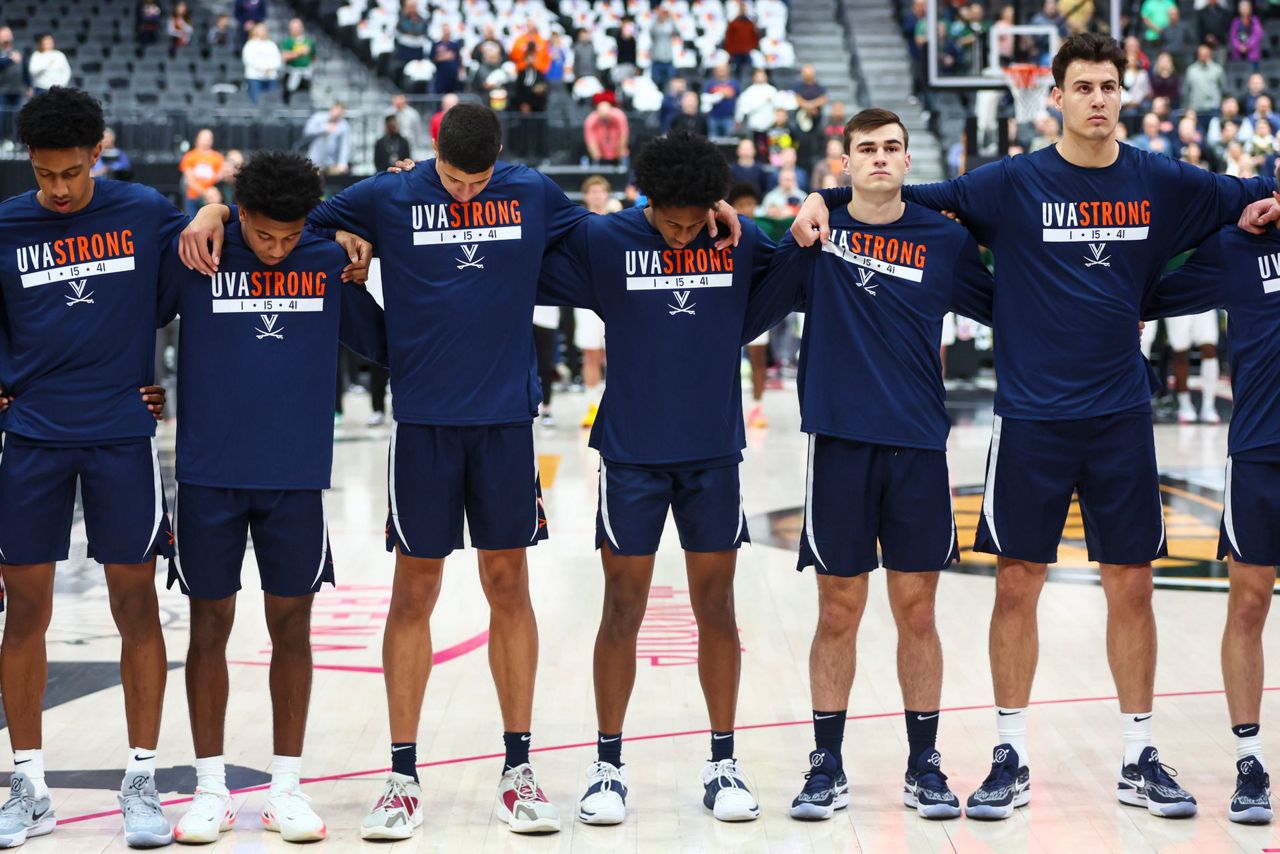 Virginia basketball back on court, honors shooting victims