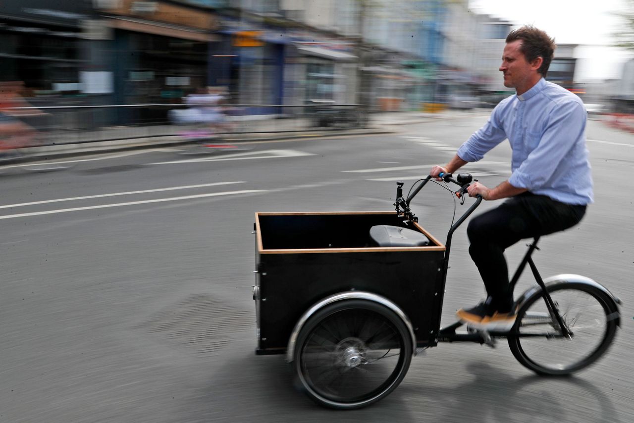 With a bike and loudspeakers, London vicar spreads the word