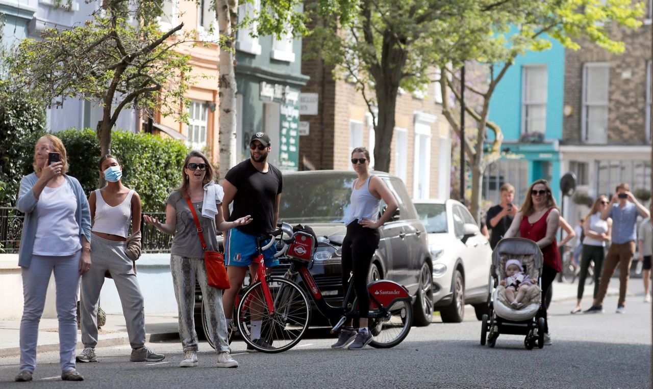 With a bike and loudspeakers, London vicar spreads the word