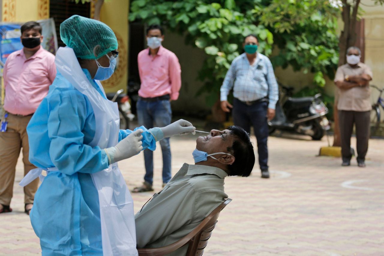 India virus cases surge nearly 32,700, beach state shut anew
