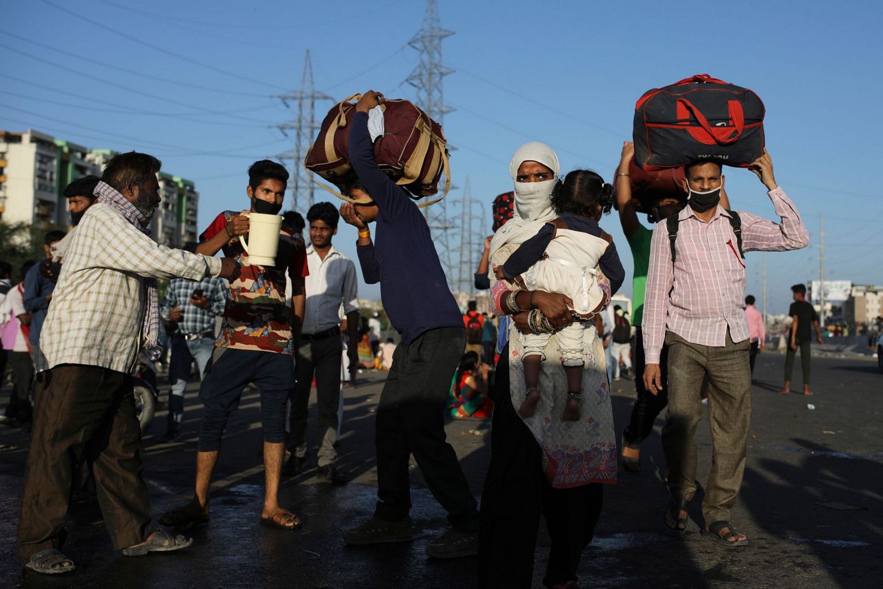 AP PHOTOS: Indian migrants walk hundreds of miles to go home