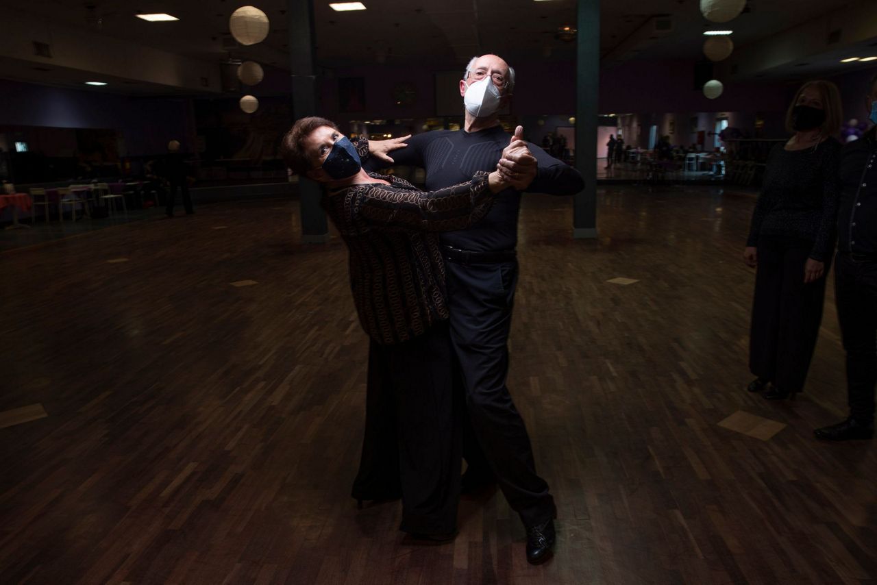 AP PHOTOS: Italy ballroom dancers twirl through lockdown