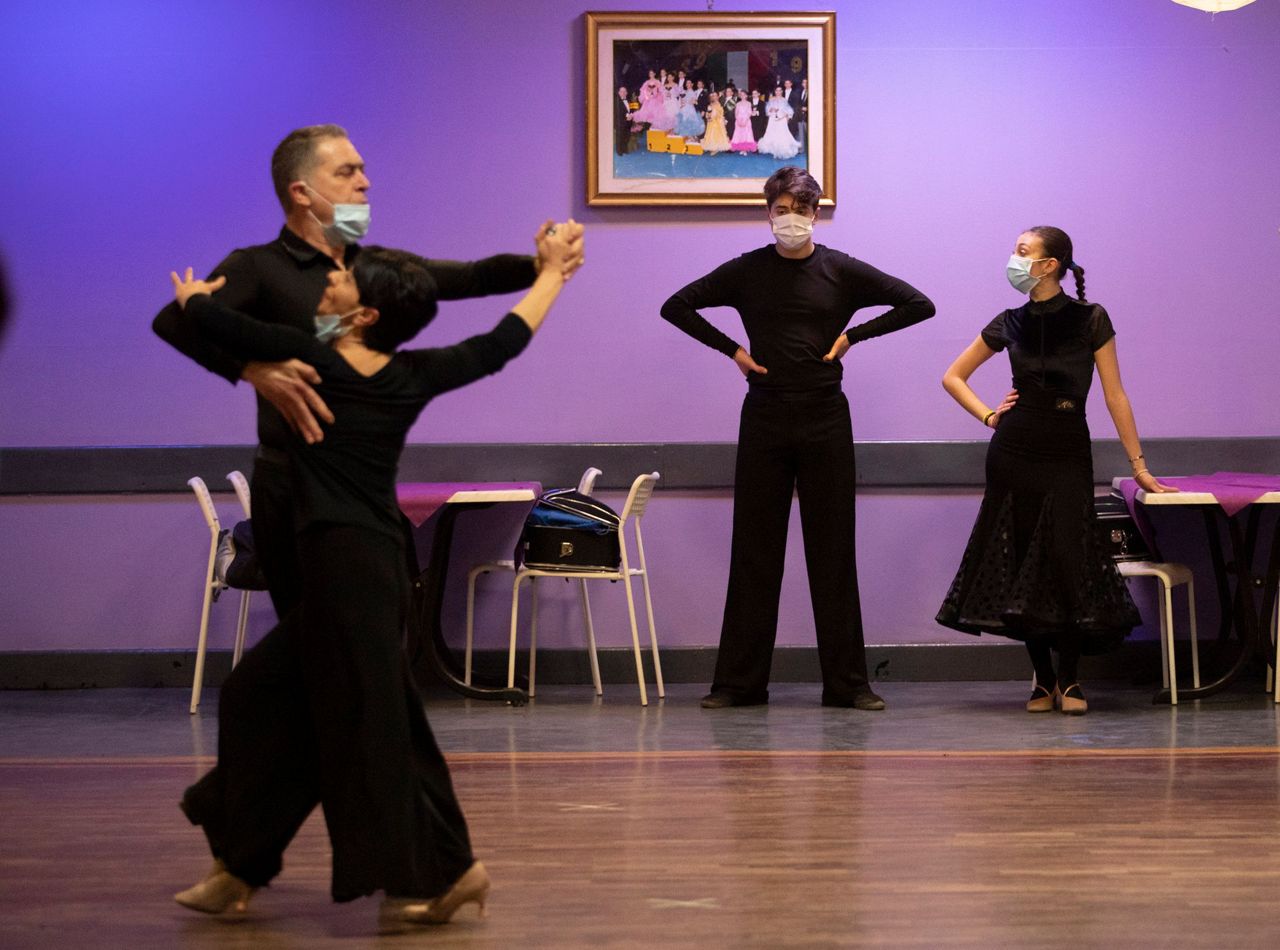 AP PHOTOS: Italy ballroom dancers twirl through lockdown