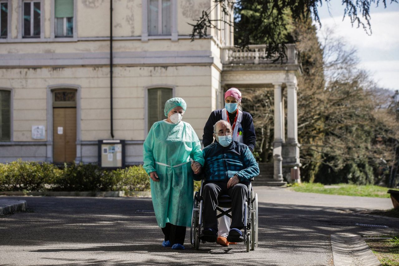 Hands touch: Italy's nursing homes emerge from COVID tunnel